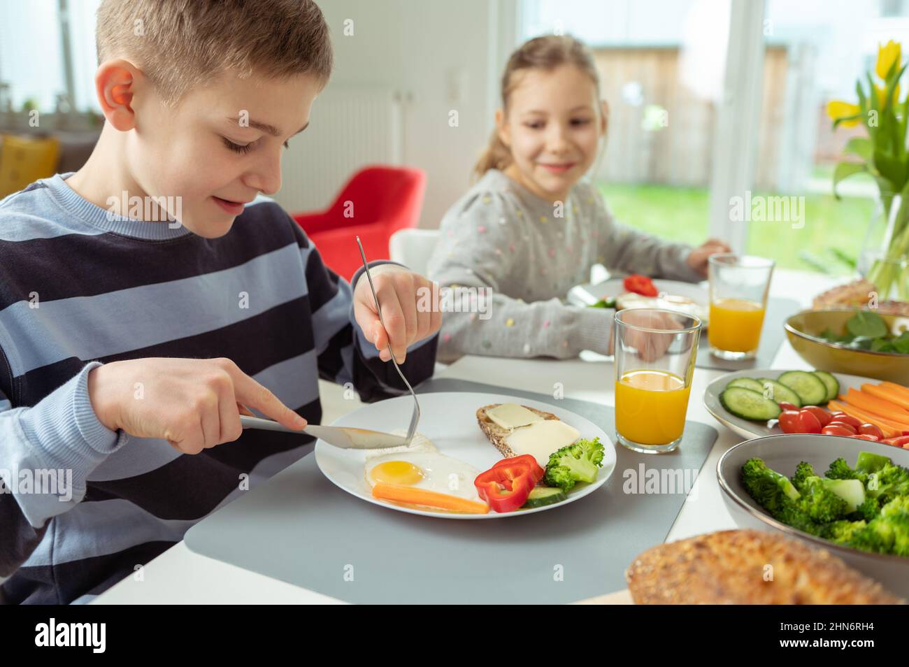 Teen children having healthy breakfast at home in the morning Stock ...