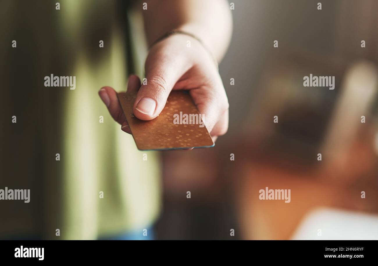 Take my money. Cropped shot of an unrecognizable businesswoman standing ...