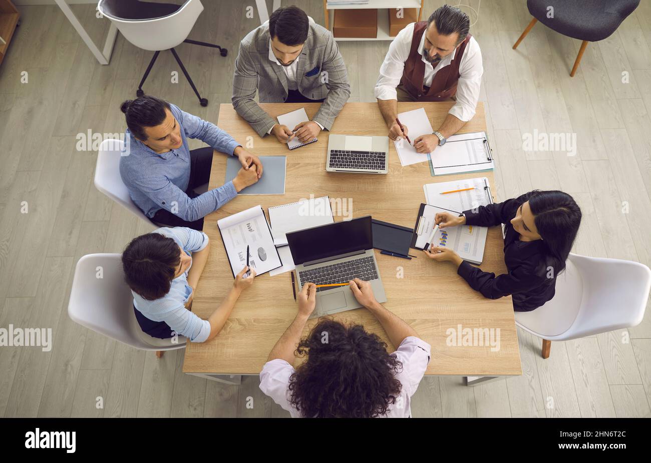 View from above of a professional business team having a meeting around ...