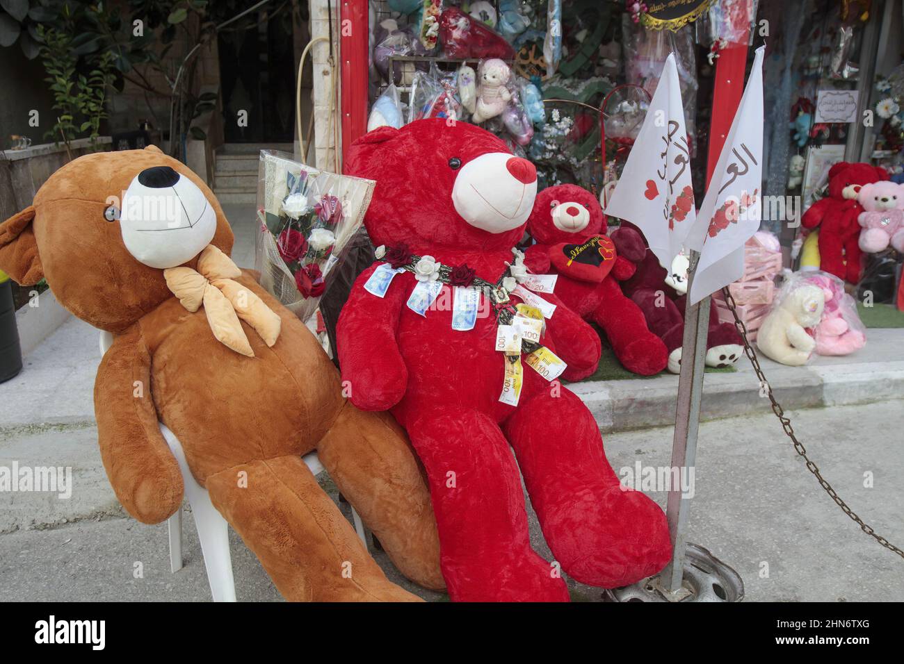 Nablus, Palestine. 14th Feb, 2022. A Palestinian displays teddy bears ...