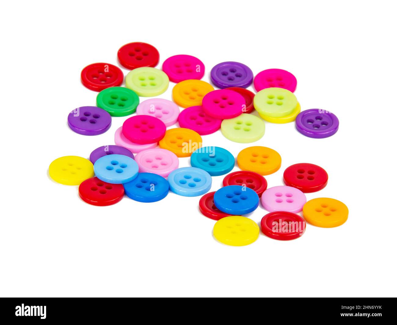 Multicolored bright cloth buttons isolated on the white background ...