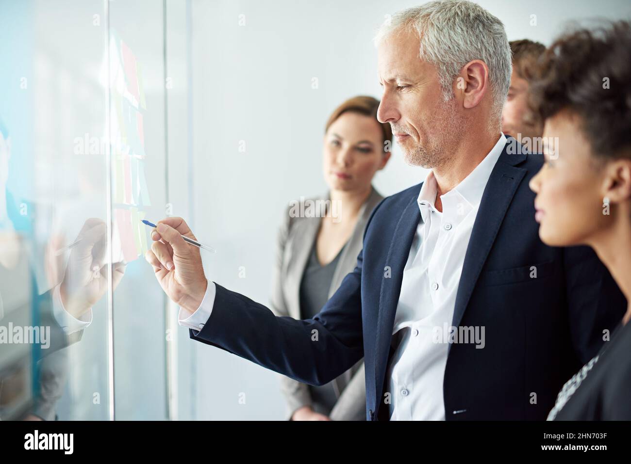 Exploring different ways to work their project. Shot of a group of ...