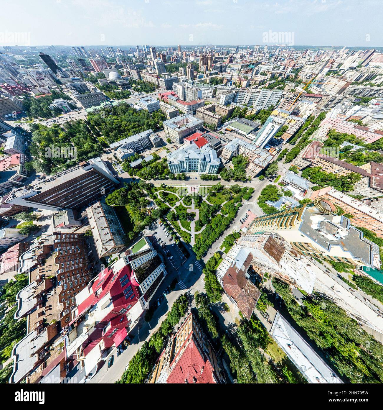 Aerial city view with crossroads, roads, houses, buildings, parks and ...