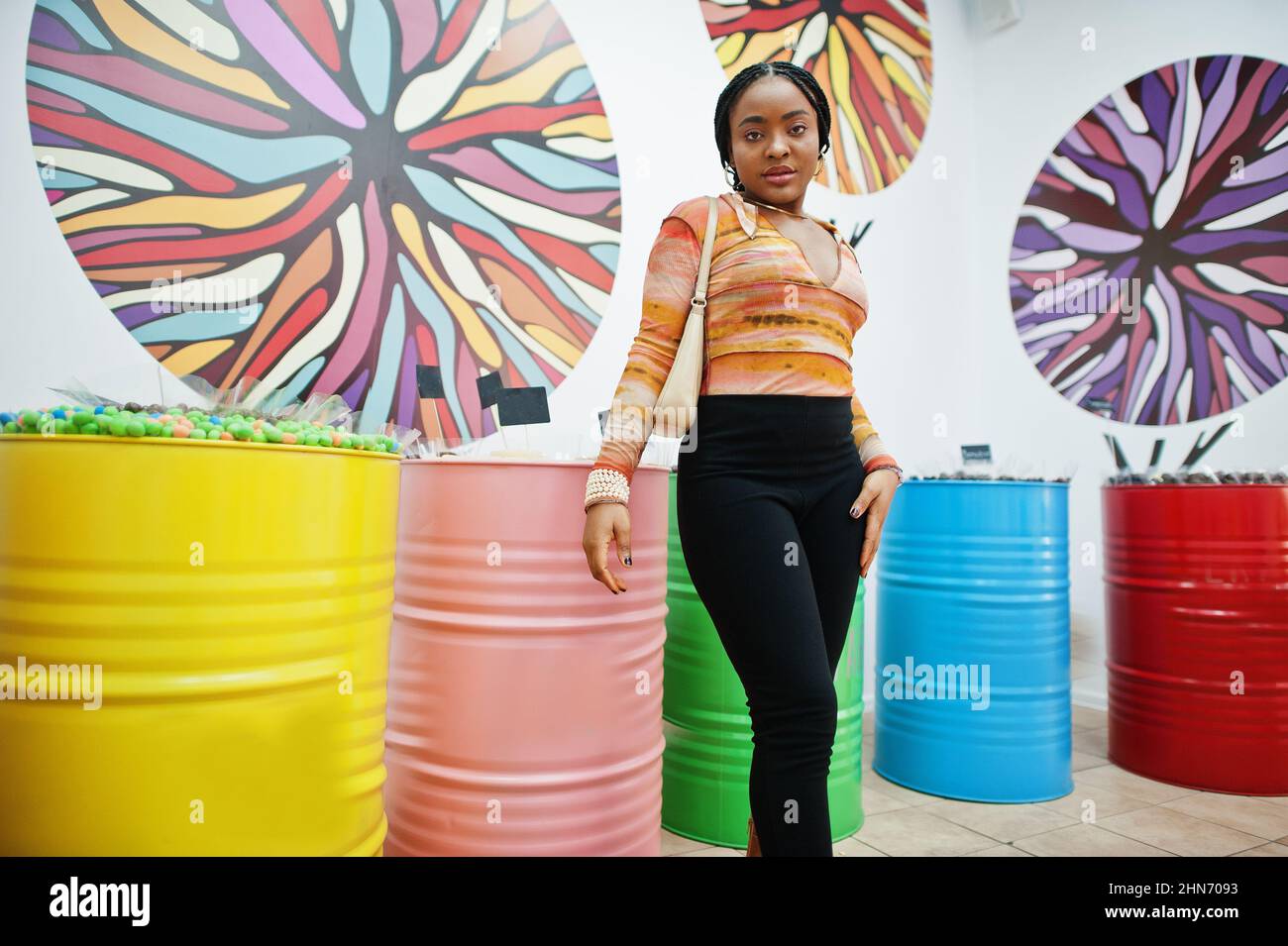 African american millennial lady at candy shop Stock Photo - Alamy