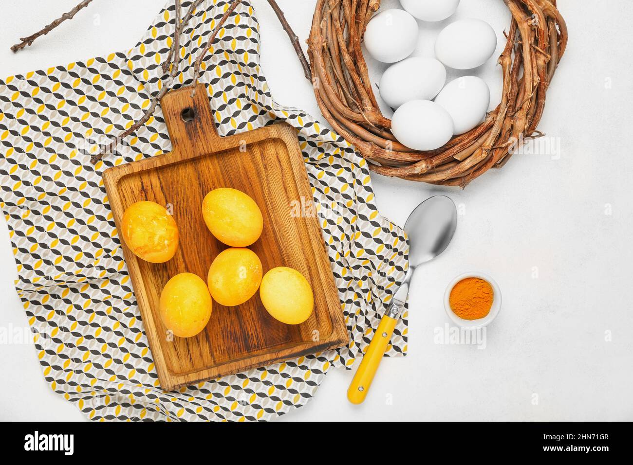 Natural dyed Easter eggs and turmeric powder on light background Stock ...