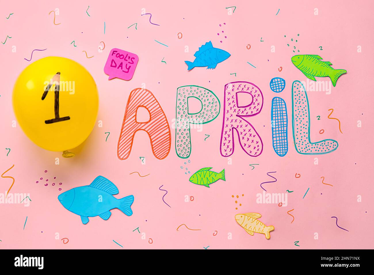 Composition with date of April Fools Day, balloon and paper decor on ...