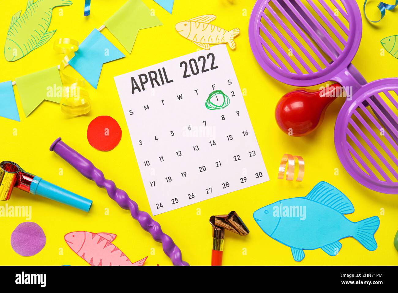 Calendar with marked date of April Fools Day and different party decor ...