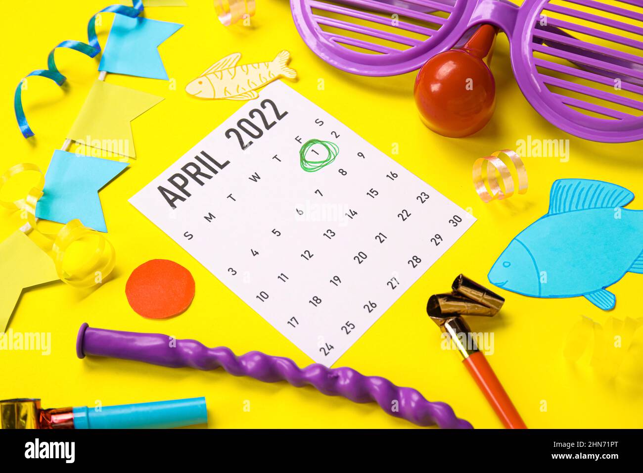 Calendar with marked date of April Fools Day and different party decor ...