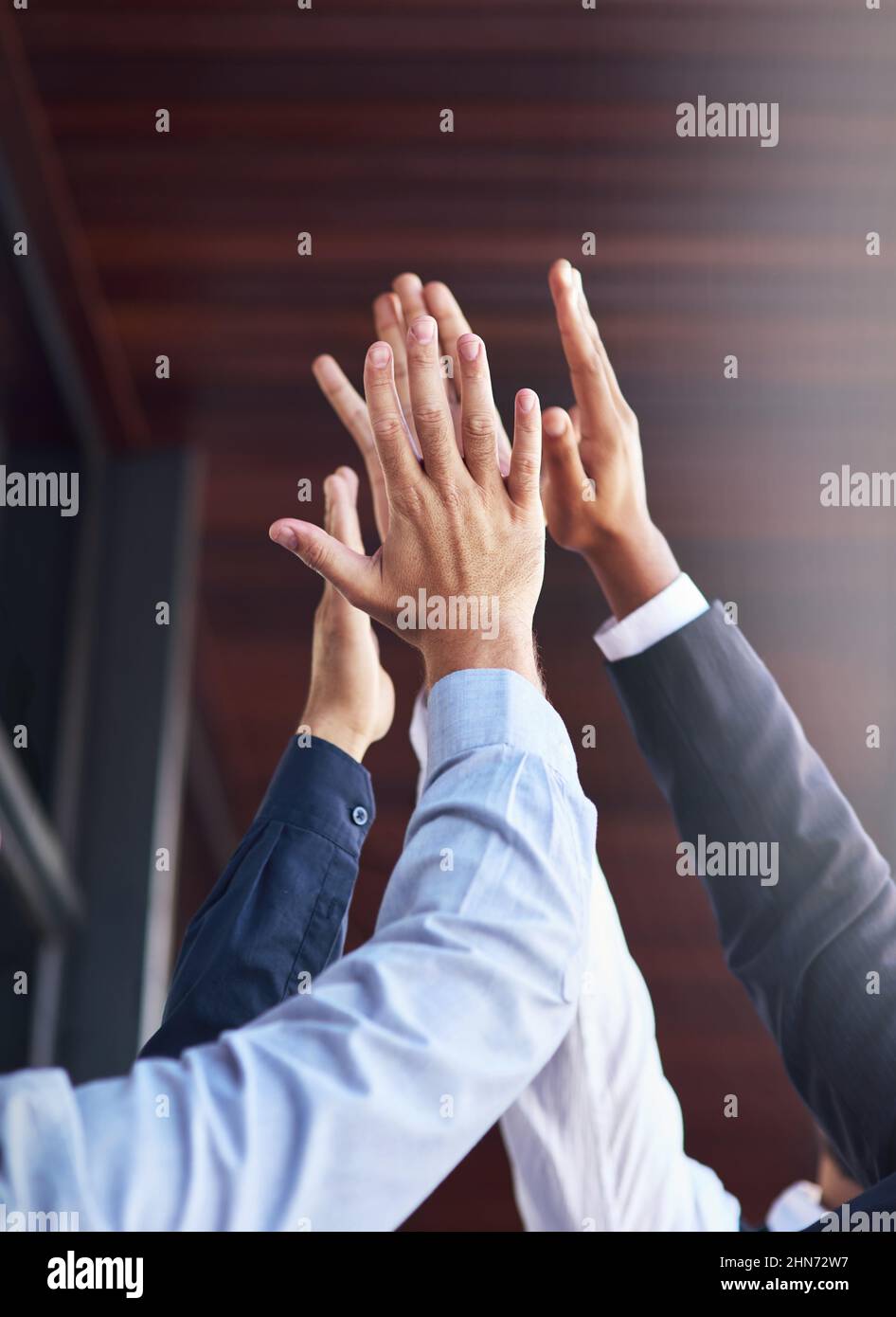 Great job team. Cropped shot of a group of unidentifiable ...