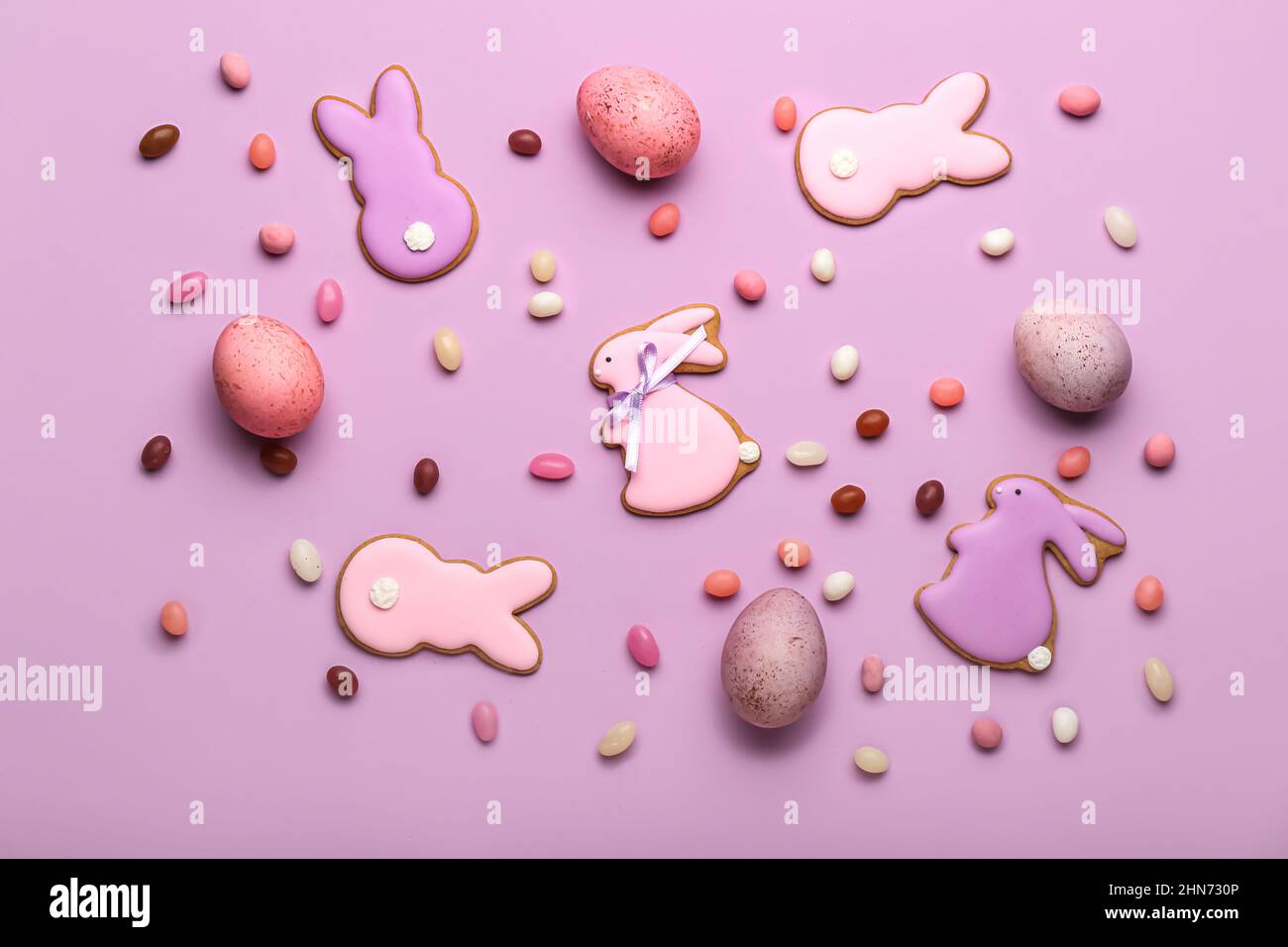 Composition with delicious Easter cookies in shape of bunny and candies ...