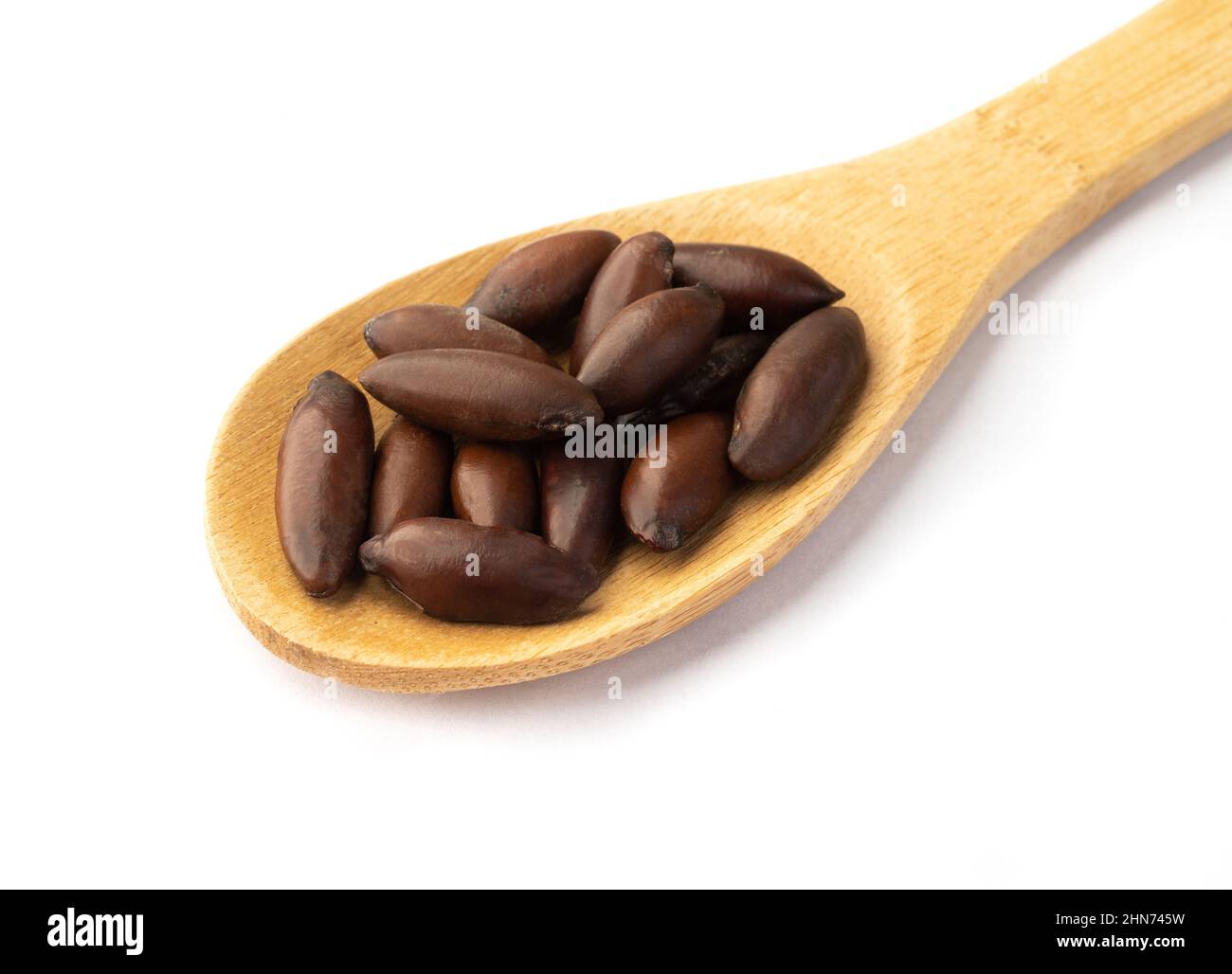 Spoon full of brazilian baru nuts isolated over white background Stock ...