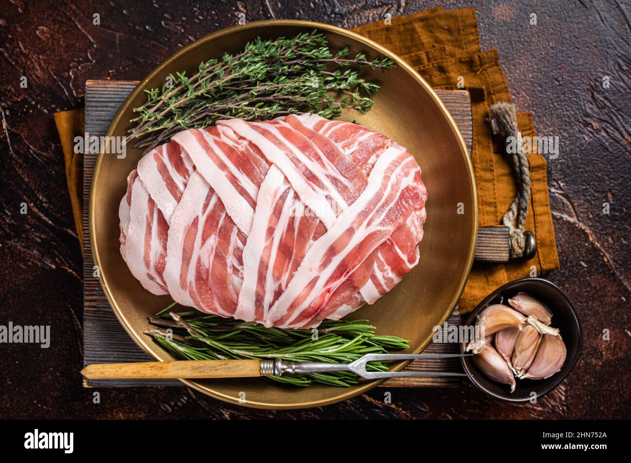 Raw meatloaf with ground beef meat and bacon with herbs and spices ...