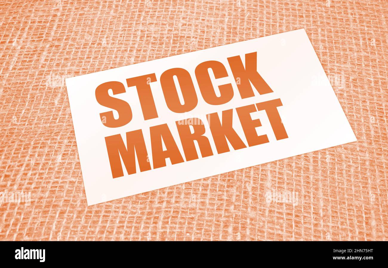 STOCK MARKET words on card on burlap canvas. Business concept Stock ...