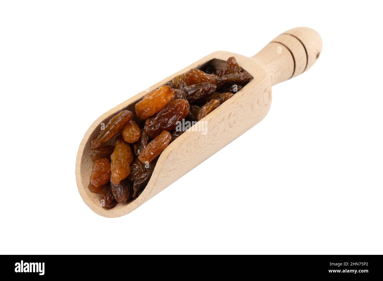royal raisins in wooden scoop isolated on white background. Spice and ...