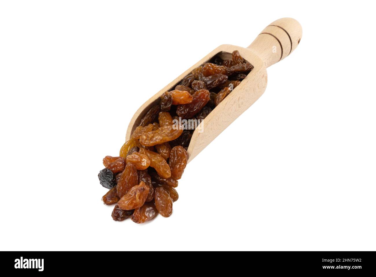 royal raisins in wooden scoop isolated on white background. Spice and ...