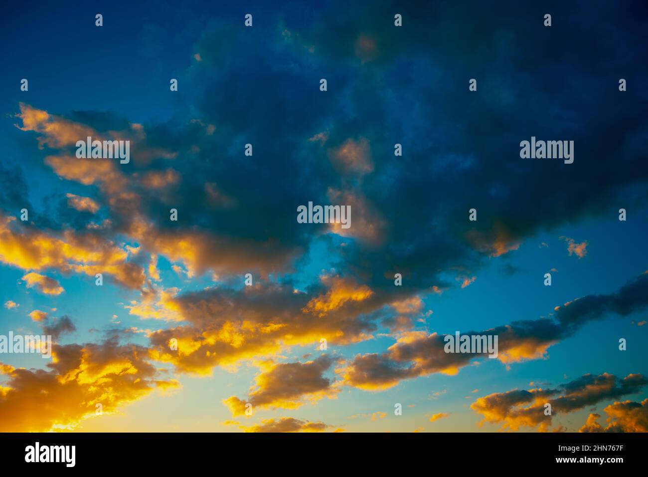 Sunset clouds. Partly cloudy sky at sunset background photo. Heaven or ...