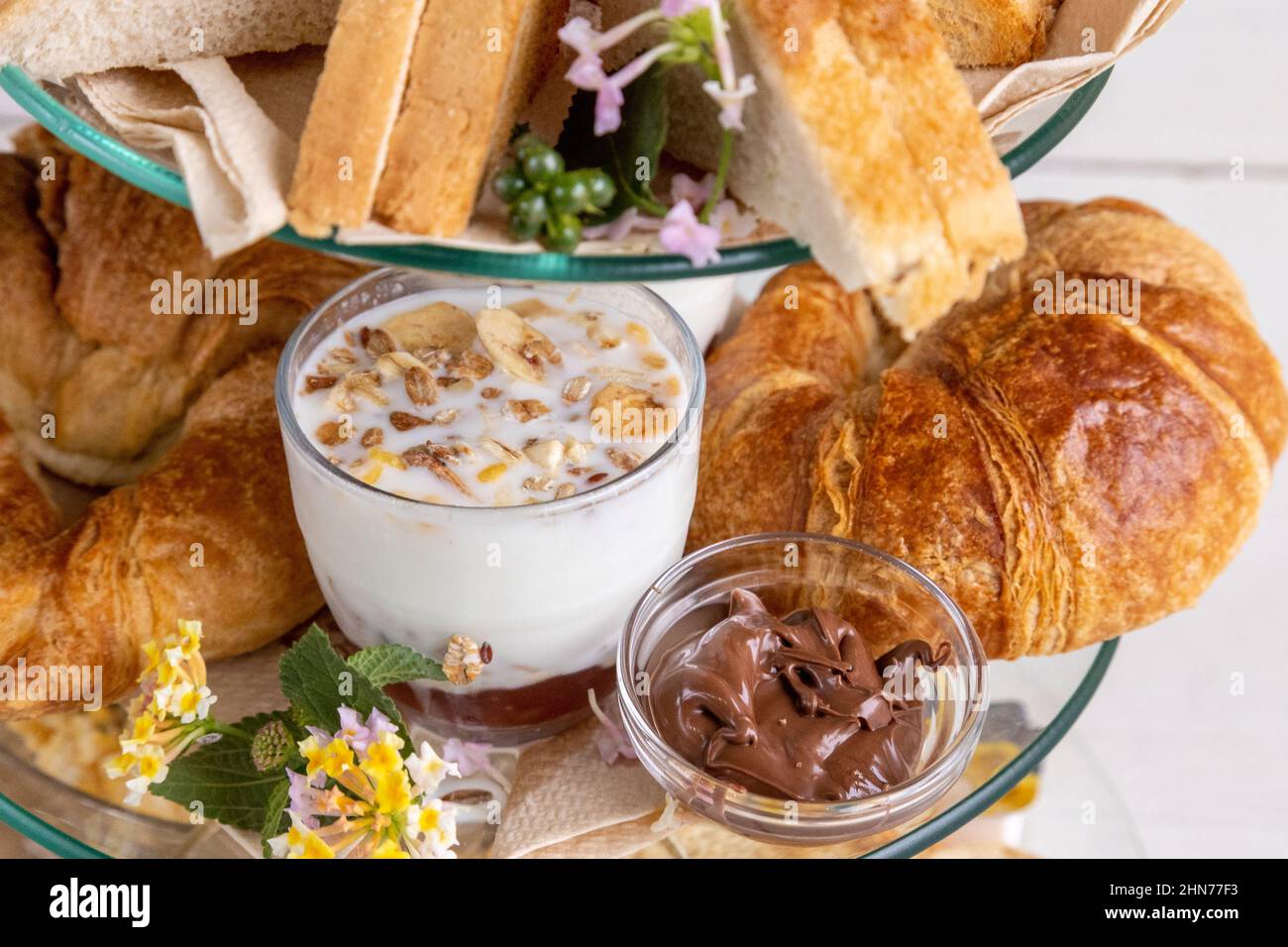 Three stage platter with dessert and sandwiches Stock Photo - Alamy