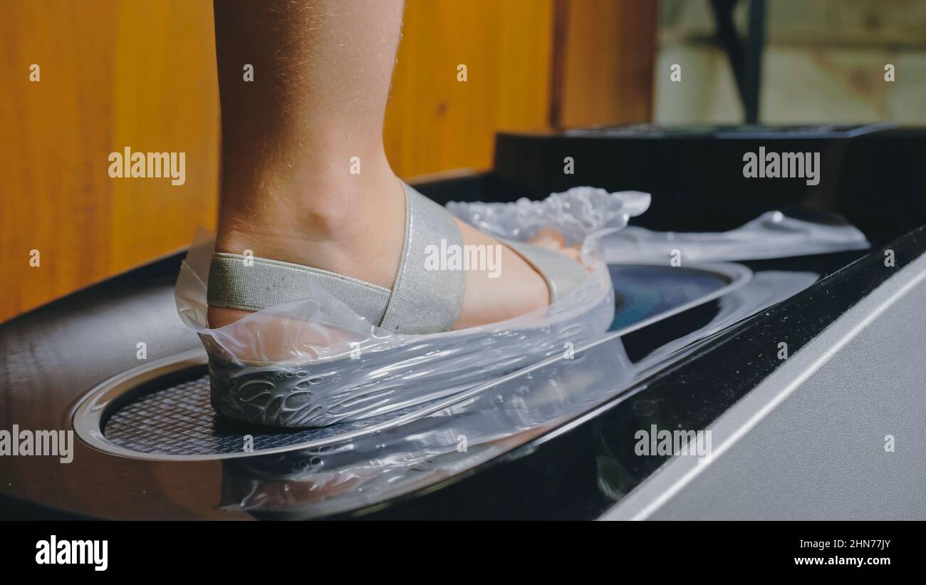 Automatic Thermal Shrinkable Shoe Cover Laminating Machine. Close up ...