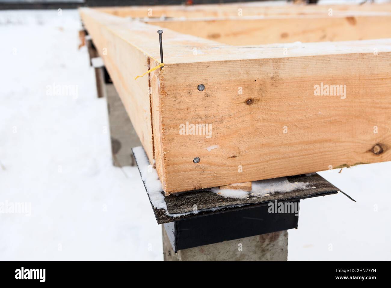Wooden corner of piled foundation with timber framework beams Stock ...