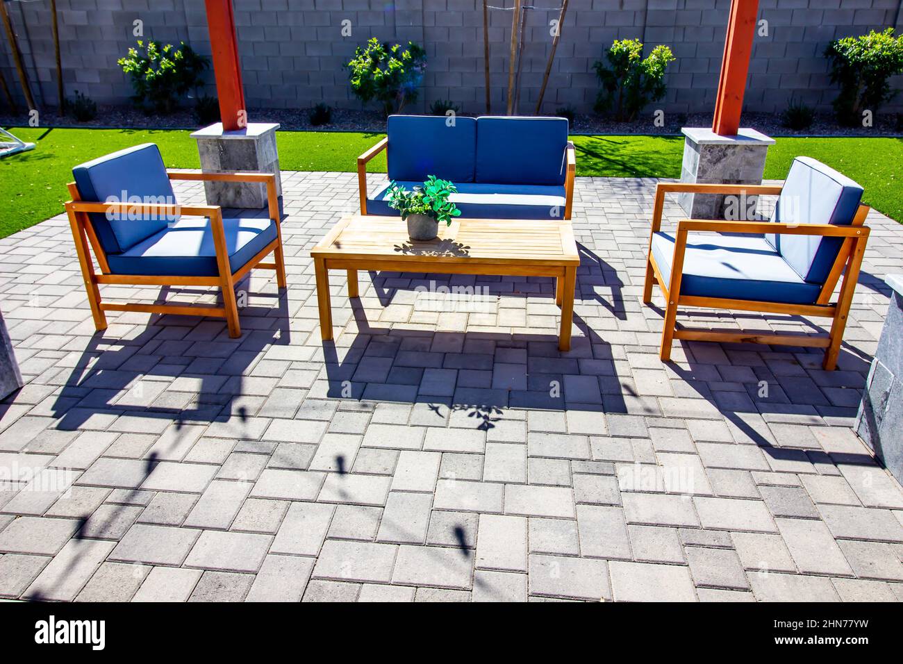 Rear Pavers Patio With Couch, Table And Two chairs Stock Photo - Alamy