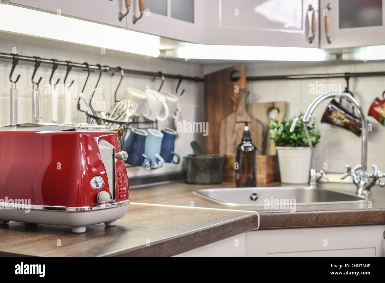Red toaster in retro slile on tabletop in kitchen interior Stock Photo ...