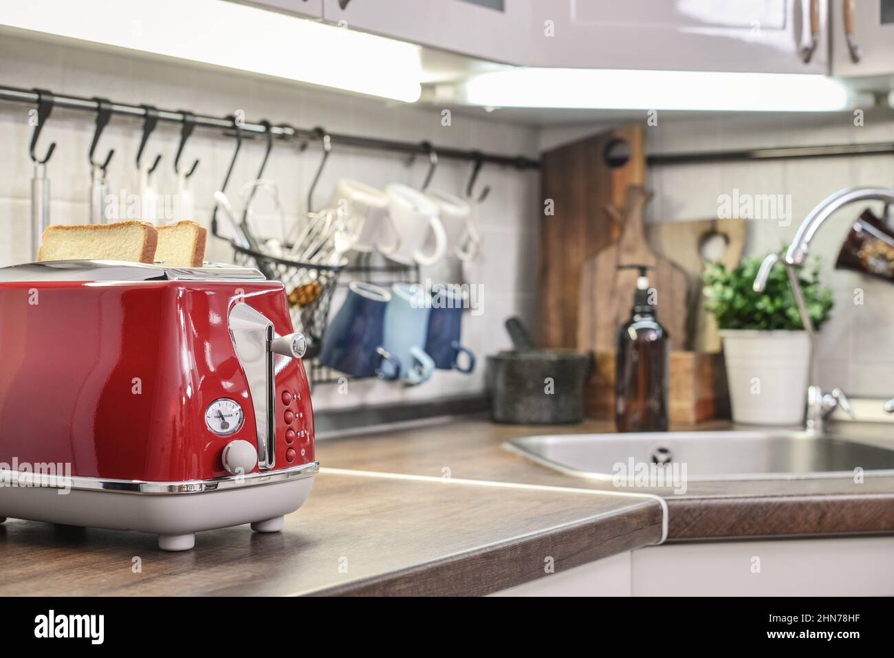 Red toaster in retro slile on tabletop in kitchen interior Stock Photo ...