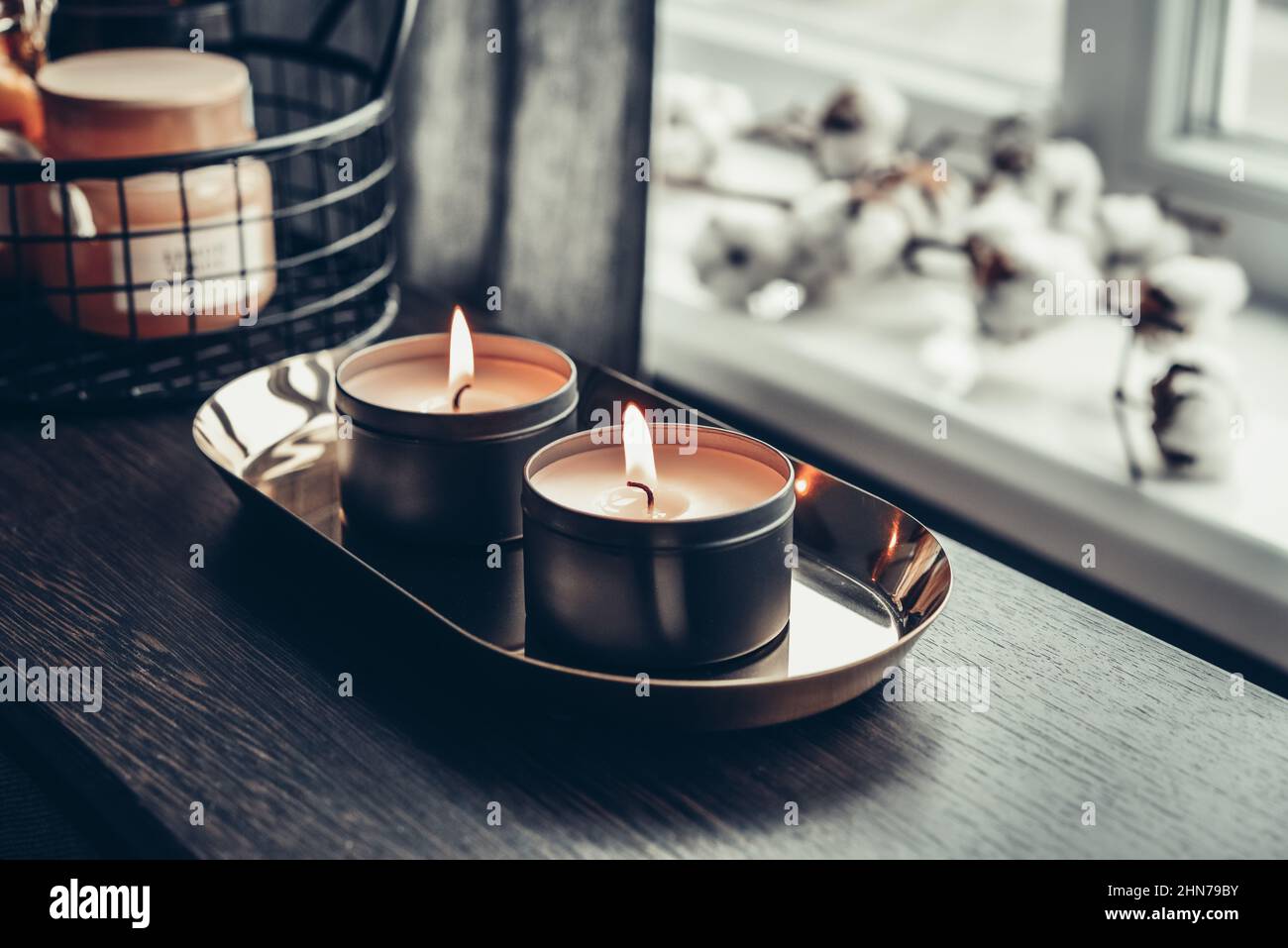 Burning candles in golden tray hi-res stock photography and images - Alamy