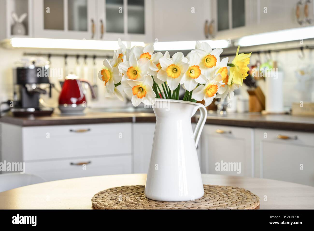 Bouquet of daffodils in interior of the kitchen in Scandinavian style ...