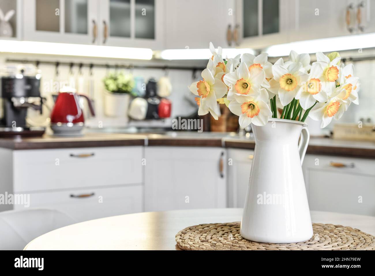 Bouquet of daffodils in interior of the kitchen in Scandinavian style ...