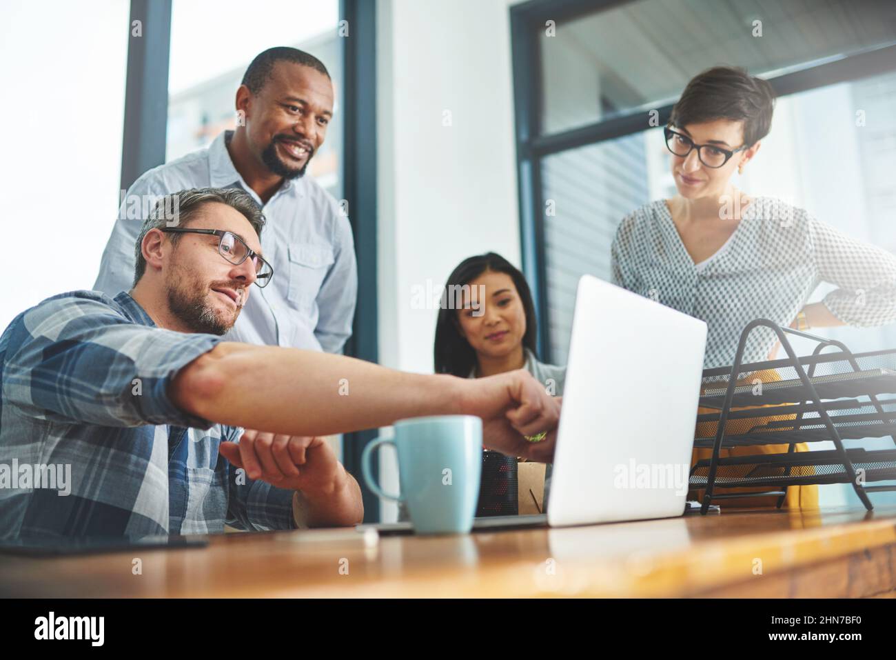 Working together to get the task done. Shot of businesspeople working ...