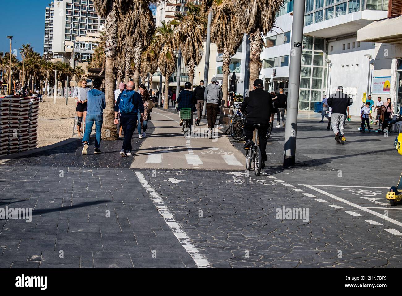 Tel Aviv, Israel - February 11, 2022 People rolling with bicycle in the ...