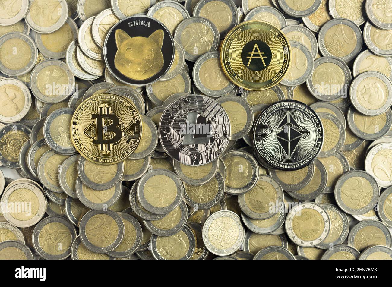 Types of cryptocurrencies represented symbolically as coins ...