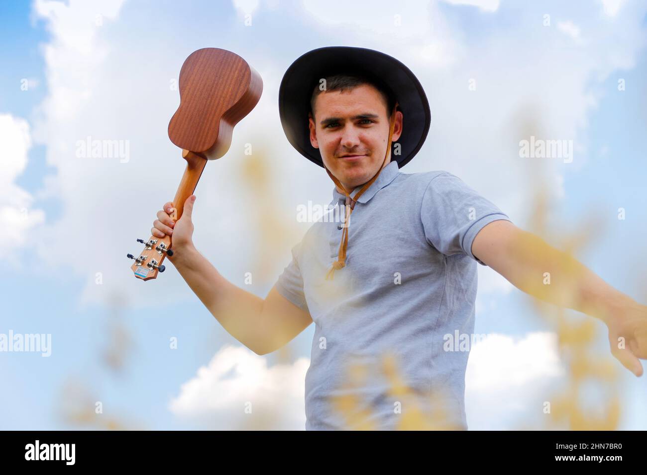 Guy playing guitar in nature hi-res stock photography and images - Alamy