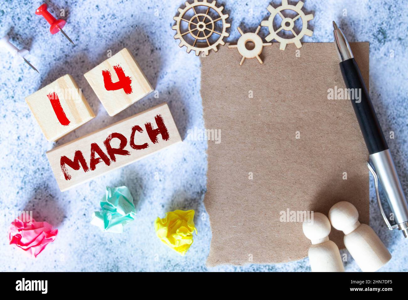 March 14th. Day 14 of month, calendar on table with yellow background. Spring time. Commonwealth ...