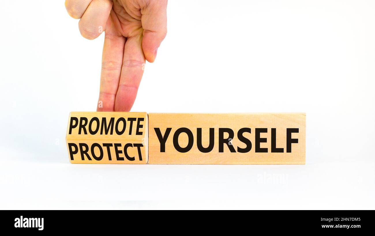 Promote or protect yourself symbol. Businessman turns cubes changes ...