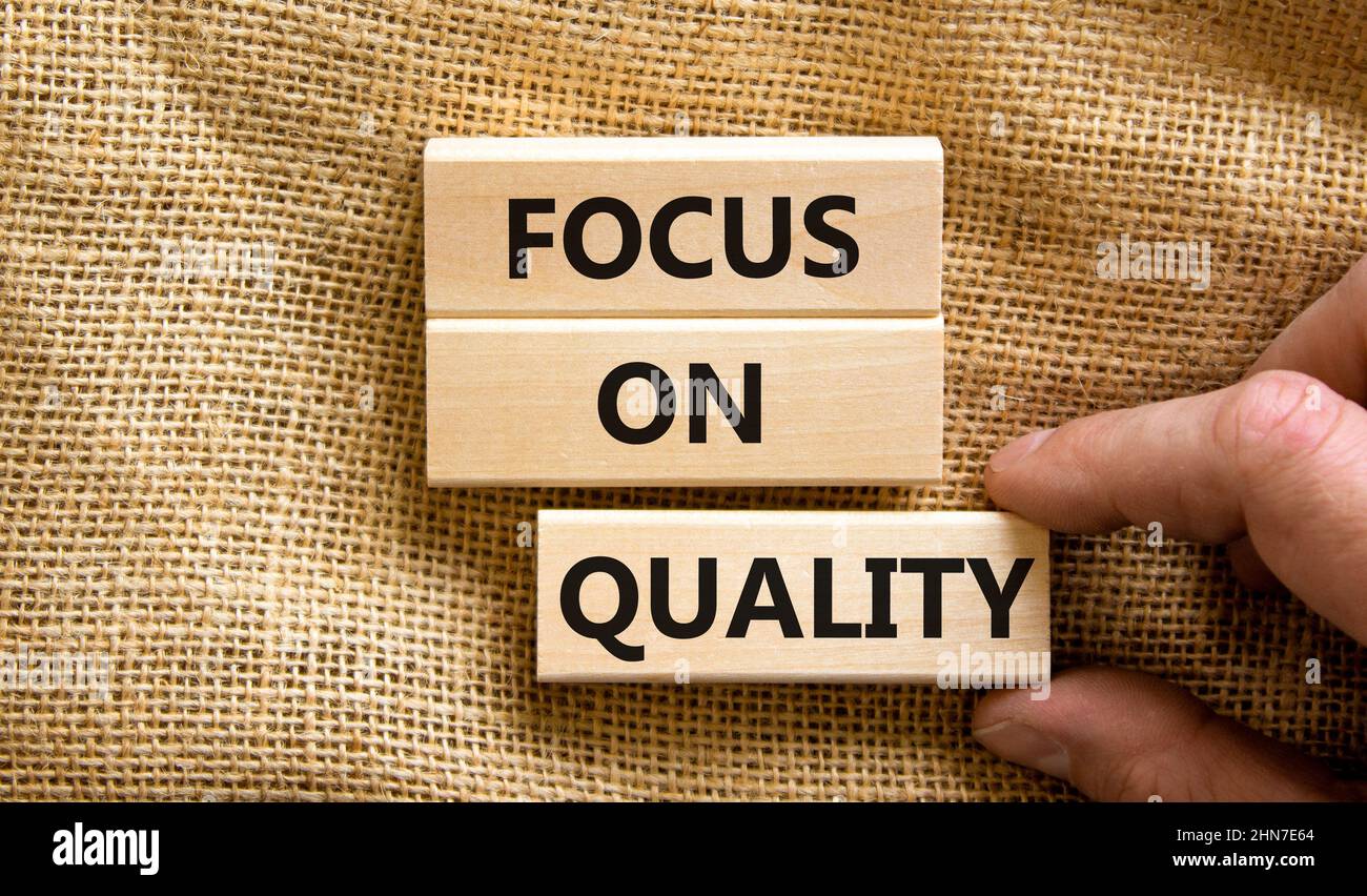 Focus on quality symbol. Concept words Focus on quality on blocks on ...
