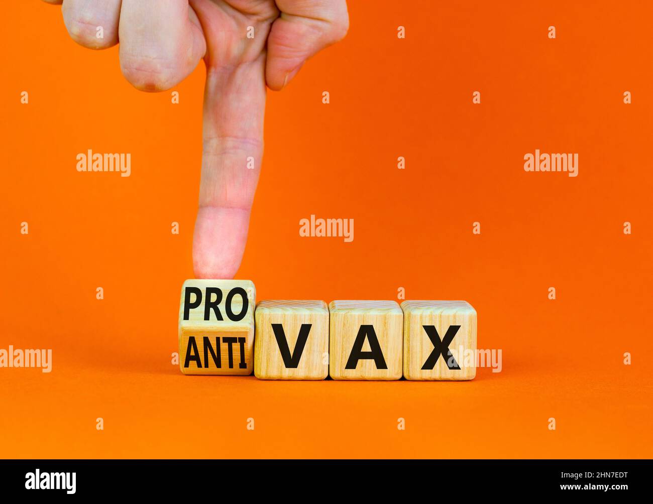Pro-vax or anti-vax Covid-19 symbol. Doctor turns cubes, changes words ...