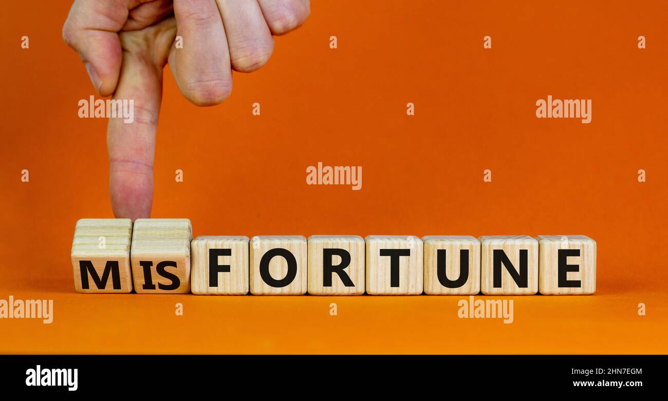 Fortune or misfortune symbol. Businessman turns wooden cubes and ...