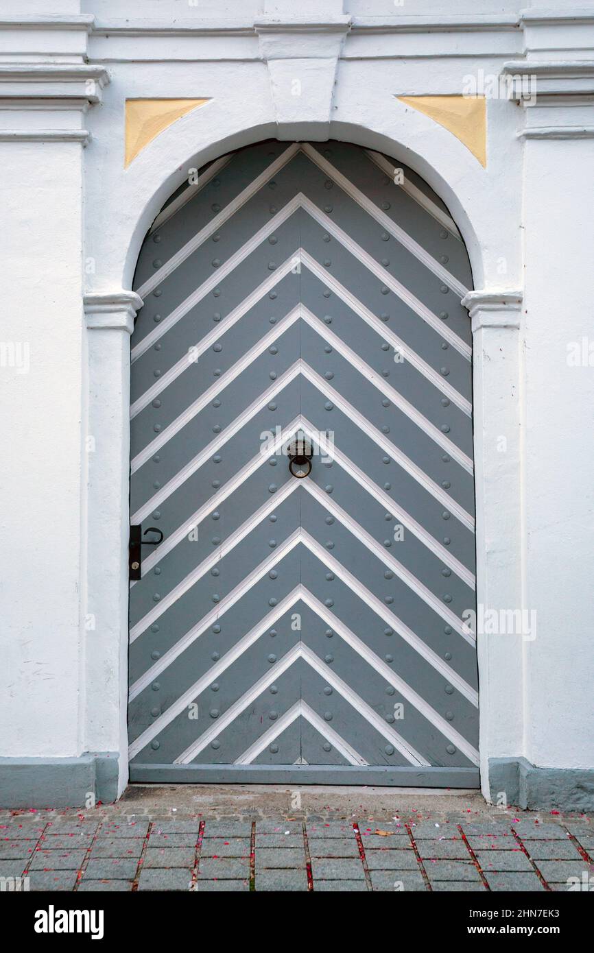 Striped door. Entrance to the house. European building. Architecture ...