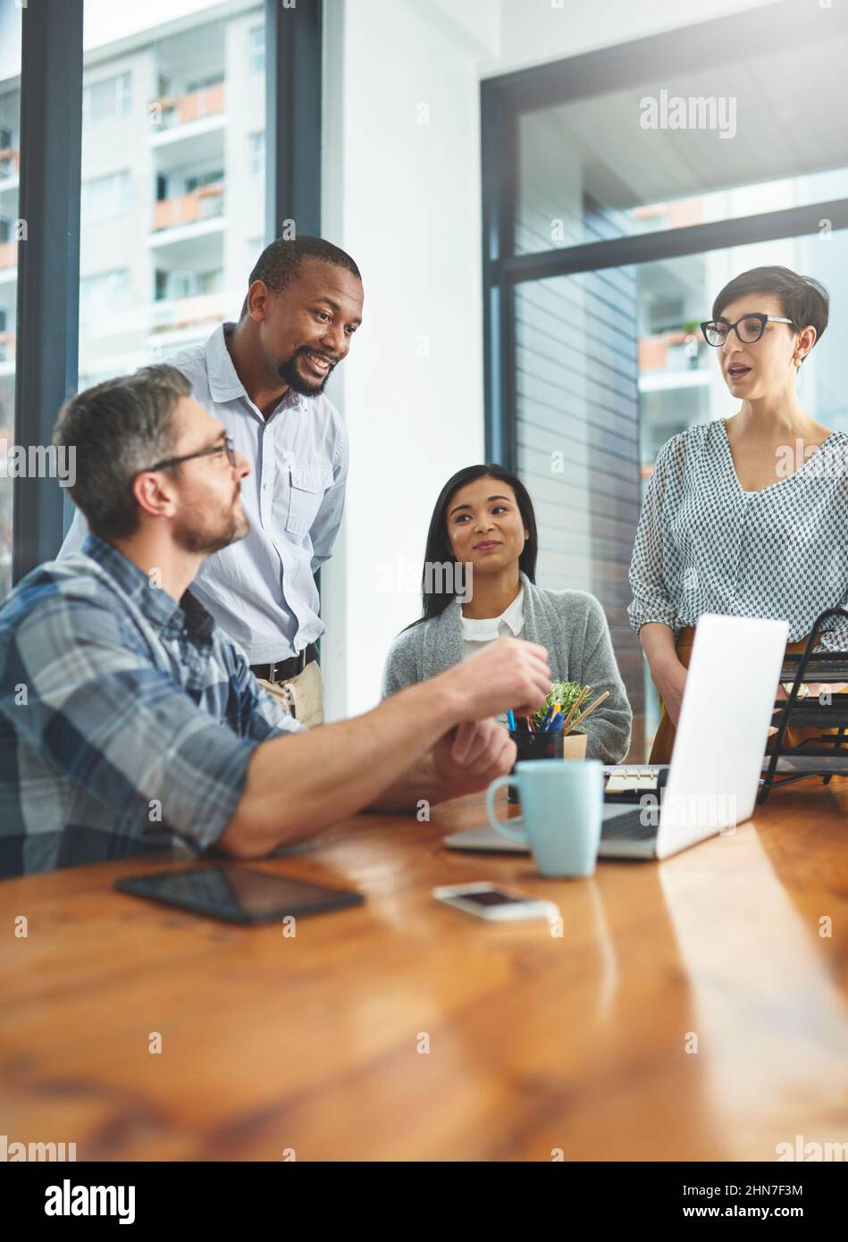 Working together to get the task done. Shot of businesspeople working ...