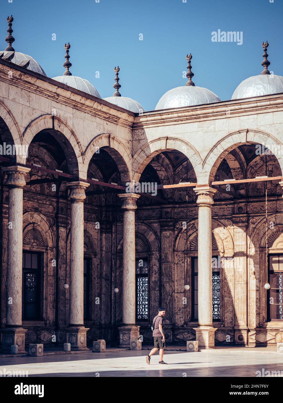Vertical shot of a person visiting the ancient building in Cairo, Egypt ...
