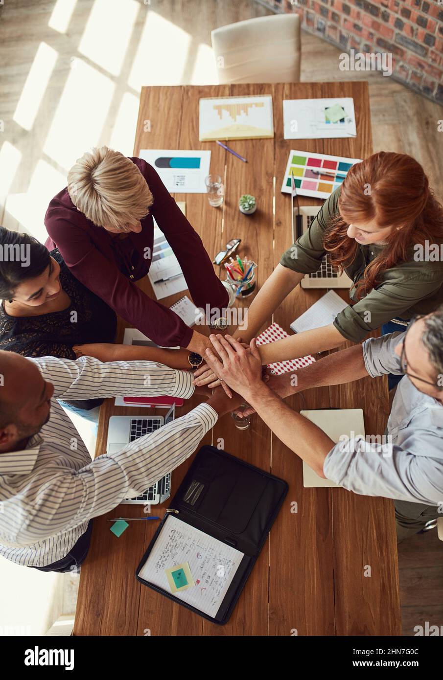 Do it together and everybody wins. High angle shot of a group of ...