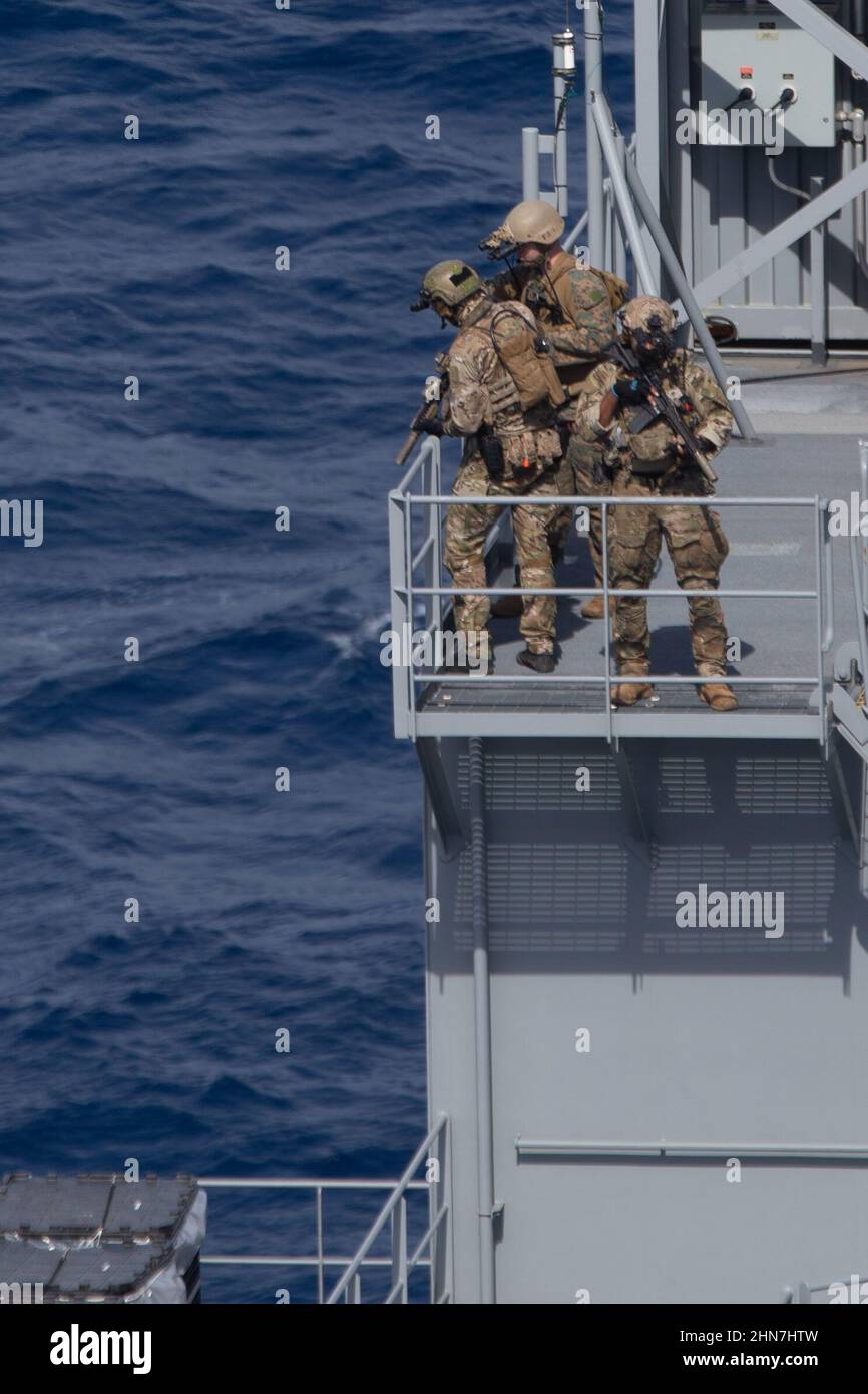 Two U.S. Naval Special Warfare SEALs and a U.S. Marine with Maritime ...