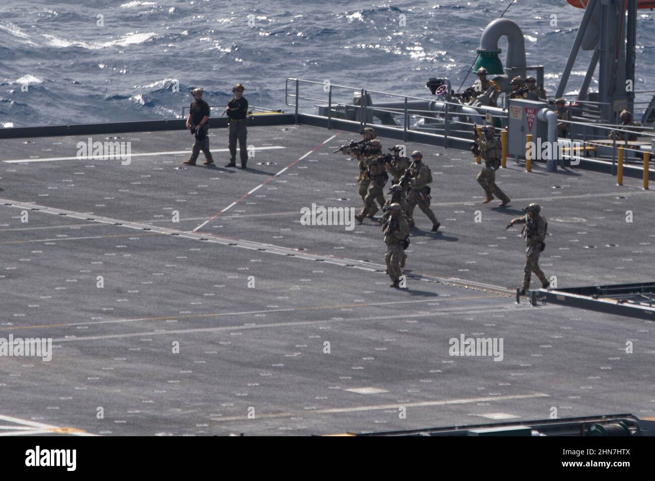 U.S. Marines with Battalion Landing Team 1/5, clear the flight deck of ...