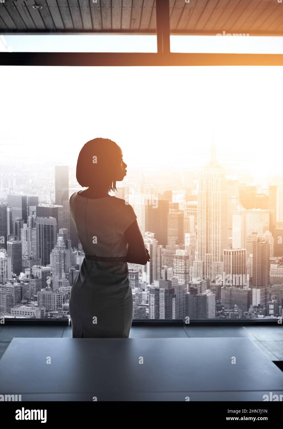 Woman looking out large window hi-res stock photography and images - Alamy