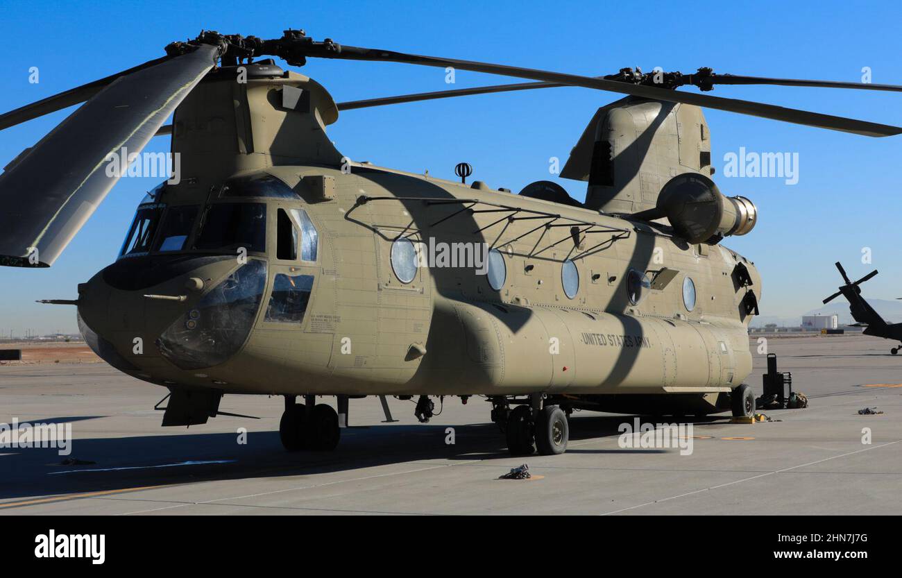 A CH-47 Chinook helicopter sits idle at a hangar before 2-501st General ...