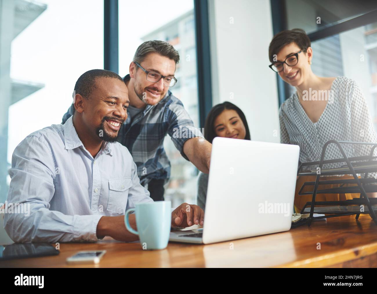 Working together to get the task done. Shot of businesspeople working ...