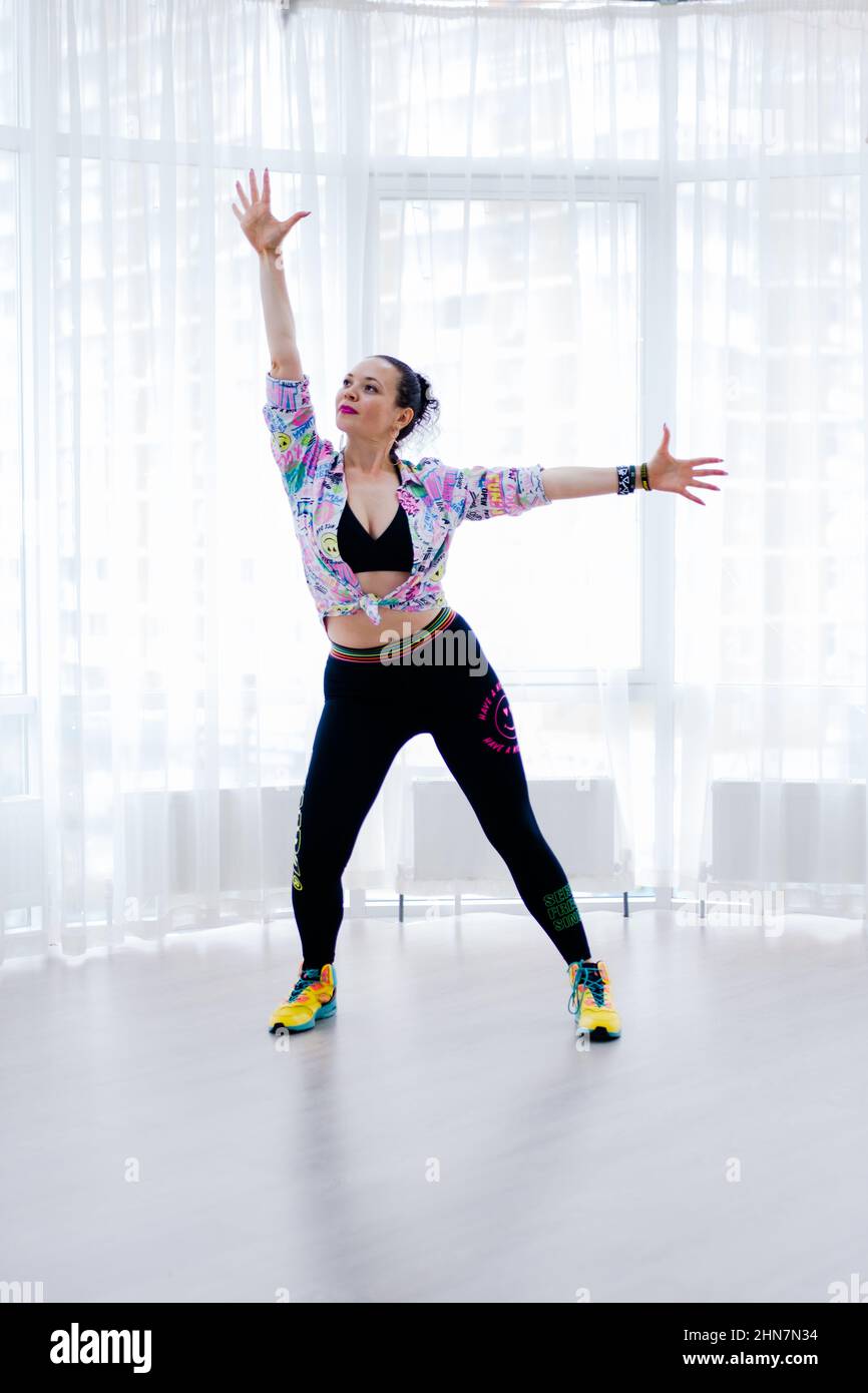 Brunette woman 30-35 years old smile and like Zumba dance. Concept ...