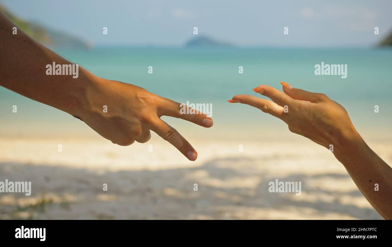 Hand shows the gesture class and rock sign. Young man and woman hands ...