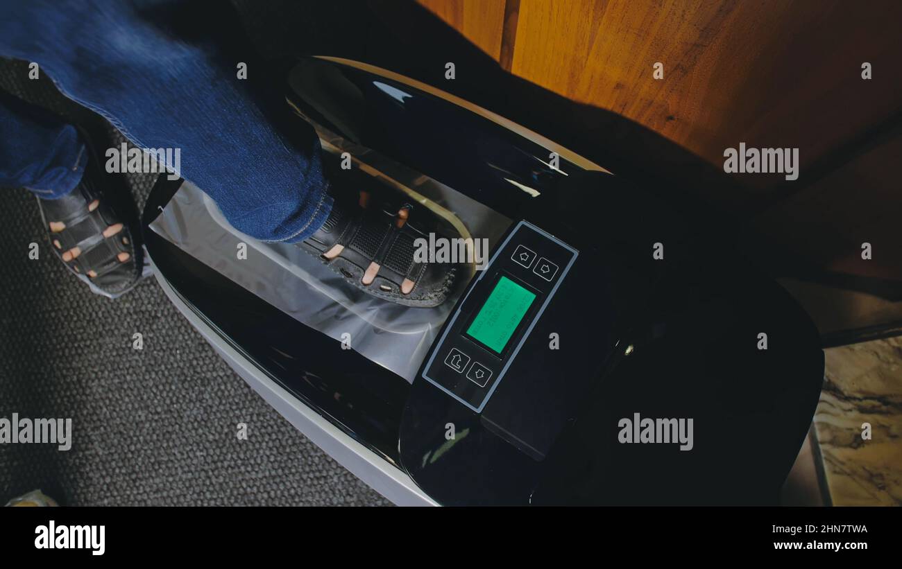 Automatic Thermal Shrinkable Shoe Cover Laminating Machine. Close up ...